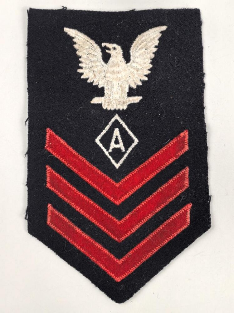 U.S. Navy rating arm badge " A" on dark blue backing, 15,00