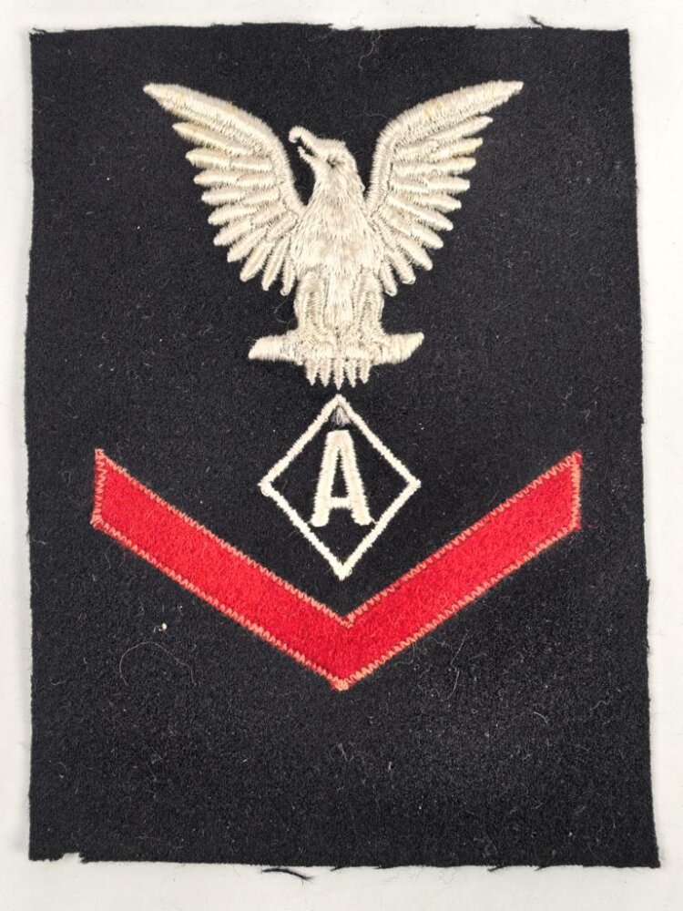 U.S. Navy rating arm badge " A" on dark blue backing, 10,00