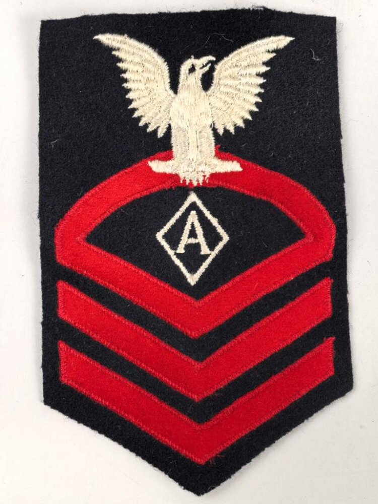 U.S. Navy rating arm badge " A" on dark blue backing, 15,00